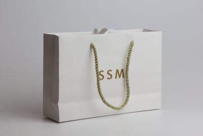 China Premium White Textured Specialty Paper Tote Bag with Gold Hot Stamped Lettering and Twisted Rope Handles for sale