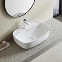 China Custom Waschbecken Bathroom Counter Top Ceramic Washbasin Luxury Oval Shaped Wash Basin Sinks for sale