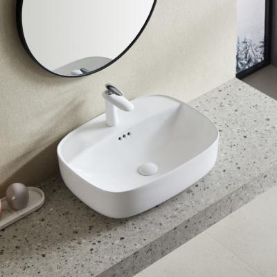 China Custom Waschbecken Bathroom Counter Top Ceramic Washbasin Luxury Oval Shaped Wash Basin Sinks for sale