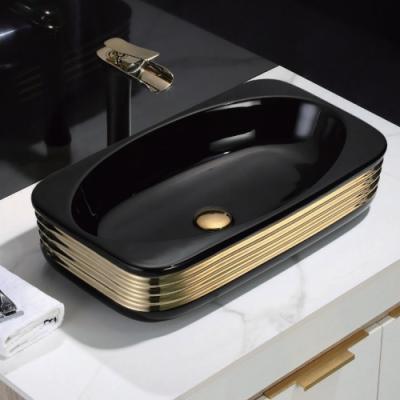 China Custom Design Counter top Matte Black Ceramic Bathroom Sink Modern Black and Gold Color Art Wash Basin for sale