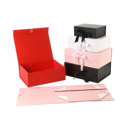 China Custom logo Clothing Shoe Folding Packaging Paper Box Manufacturer Cardboard Rigid Folded Magnetic Gift Box with Ribbon for sale