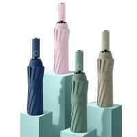 China 12k Rubber Coated Handle Automatic Windproof UV Protection Travel Umbrella for Items for sale