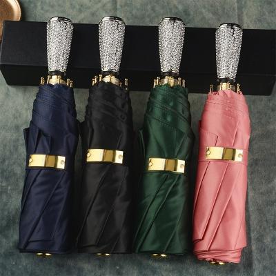 China Manual Control Diamond Insert Handle 3 Fold Umbrella Unique Rain Umbrellas for Women for sale