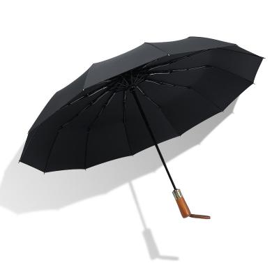 China Carom Cloth Fabric Material Travel Umbrella with Wooden Handle 12 Rib Windproof Design for sale