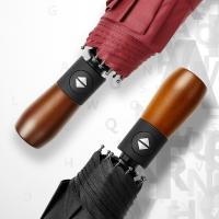 China Fiberglass Ribs 23inch 12K 210T Pongee Auto Umbrella with UV Blackcoated Wooden Handle for sale