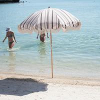 China Tourist Attraction Must-Have Outdoor Tassel Beach Umbrella with Umbrellas Base for sale