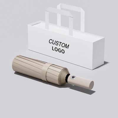 China Business Men Gift Three-folding Umbrella with Custom Logo and 95cm Open Diameter for sale