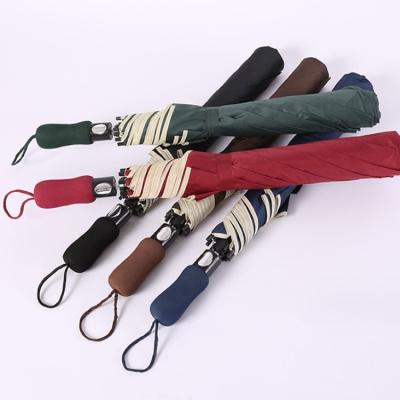 China Back to School Stylish 2fold Fiberglass Umbrella for Business Men Color Changing Frame for sale