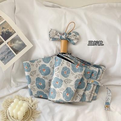 China Customized Appearance Level Blue Flowers Sunshade Sunblock Umbrella with Metal Frame for sale