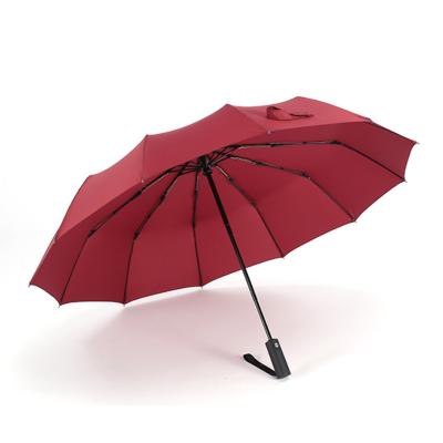China Rubber Coated Handle 12k 23inch Windproof Triple Folding Umbrella with Customized Logo for sale