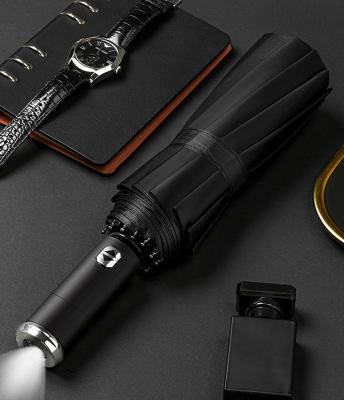 China 23 Inches*10k Fully Automatic Folding Umbrella with 180Rotating LED Flashlight Handle for sale