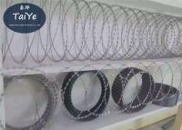 China Sharp Flat Wrap Razor Wire Coil In Railway Protective Anti Climbing for sale
