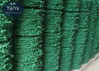 China PE PVC Coated Security Barbed Wire Stoving Varnish Razor Coil Barbed Wire for sale
