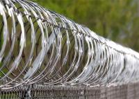 China Galvanized Roll Packing CBT 65 Razor Wire Fence On Welded Wire Mesh Panel for sale