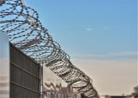 China Concertina Coil Razor Barbed Wire CBT Type Galvanized Crossed With Clips for sale