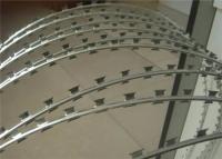 China Razor Ribbon Helical Barbed Tape Galvanized Core 18 Inch Diameter 50ft Rolls for sale