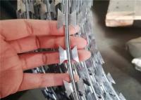 China Coil Razor Barbed Wire Mesh Fencing Razor Barbed Tape Wire For Wall Top And Border for sale
