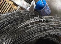 China Barbed Tape Concertina Gaucho Barbed Wire Prison High Security Spiral Barbed Wire Fence for sale