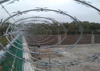 China Cbt -60 Concertina Razor Barbed Tape Wire On Chain Link Fence Razor Fence for sale