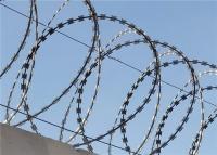 China Razor Blade Fencing Spiral Razor Wire Military Barbed Tape Concertina Roll for sale