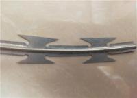 China Sharp Wire Fence Razor Ribbon Barbed Tape Concertina With Blades Wire Barrier Fencing for sale