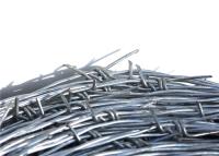 China Galvanized Spiral Barbed Wire military Fence 12.5# Barbed Wire used on Home or border for sale