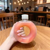 China Round Shaped Beverage Bottle Customized Printed logo 16oz 500ml Juice PP Donut Bottle with Ring Lid for sale