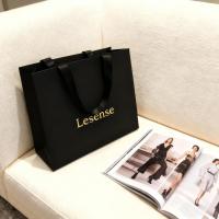China Redefine Luxury Packaging Custom Branded Black Paper Gift Bags for sale
