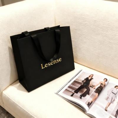 China Redefine Luxury Packaging Custom Branded Black Paper Gift Bags for sale