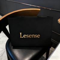 China Redefine Luxury Packaging Custom Branded Black Paper Gift Bags for sale