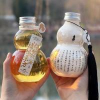 China Trend Gourd Shaped Round Bottom PET Plastic Cold Drink Tea Juice Bottles with Aluminum Cap for sale