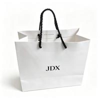 China Retail Paper Shopping Bags With Handles Kraft Black Paper Bags Bulk for sale