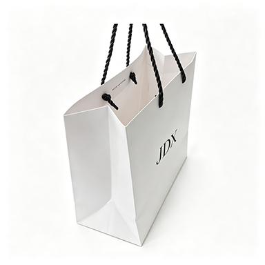 China Retail Paper Shopping Bags With Handles Kraft Black Paper Bags Bulk for sale