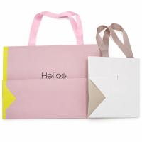 China Elegant Pink Custom Paper Gift Bags Printed Luxury Bulk Shopping Bags With Handles Ribbon for sale