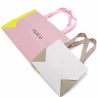 China Elegant Pink Custom Paper Gift Bags Printed Luxury Bulk Shopping Bags With Handles Ribbon for sale
