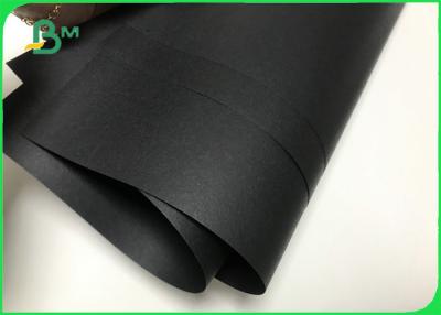 China 110gsm To 170gsm Double Sides Solid Black Craft Paper Rolls For Clothes Tag for sale