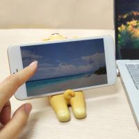 China Customized Color Cute Cell Phone Desk Holder Non Phthalate PVC Dog Phone Stand for sale
