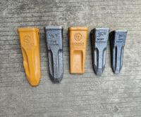 China JUYULONG  320C/323GX Rock Tooth Seat Steel Tilt Bucket Tooth Pin Wear Resistant 1U3352 Forging for sale