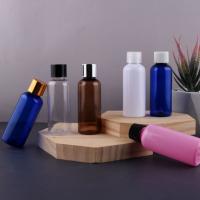 China 100ML PET Plastic Bottles Clear Cosmo Round Bottles With Natural Disc Top Caps for sale