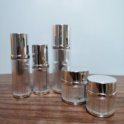 China Hot sell 30g 50g silver plastic PMMA arcylic ribbed double walled plating round skincare cosmetic facial cream jar for sale