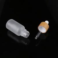 China Hot sale frosted amber eye cream essential oil cbd oil cosmetics lotion glass bottle with bamboo dropper cap for sale
