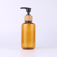 China Amber Transparent Round Shoulder PET Plastic Press Pump Bottle For Shampoo 130ml for sale
