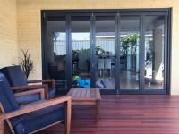 China Aluminum Folding Doors 1.0-2.0mm Frame with Powder Coating and Single/Double Glazed Glass for Commercial Use for sale