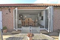 China WY-Tec Aluminum Folding Doors 1.0-2.0mm Thickness with Powder Coated Frame and 5-Year Warranty for sale