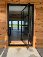 China Slim Frame Custom Aluminium Pivot Doors with Double Glazing and 5-Year Warranty - Modern Design for sale