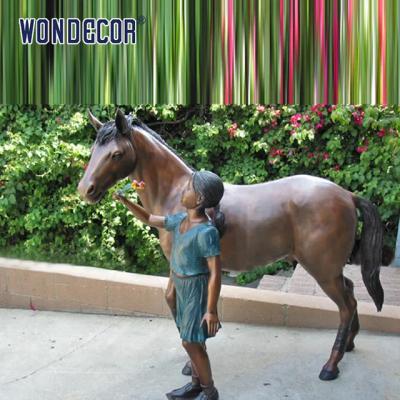 China Custom Life Size A Bronze Statue Of A Girl Playing With Her Horse Friend for sale