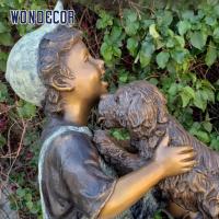 China Custom Life Size A Bronze Statue Of A Young Man Playing With His Dog for sale
