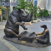China Smooth Bronze Sculpture Art Rhinoceros And Dog Playing Chess Together for sale