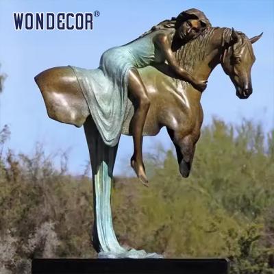 China A Copper Sculpture Of A Young Girl On A Large Metal Art Horse Back Outdoors for sale