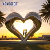 China Large outdoor square modern abstract geometric hollow heart-shaped stainless steel sculpture for sale